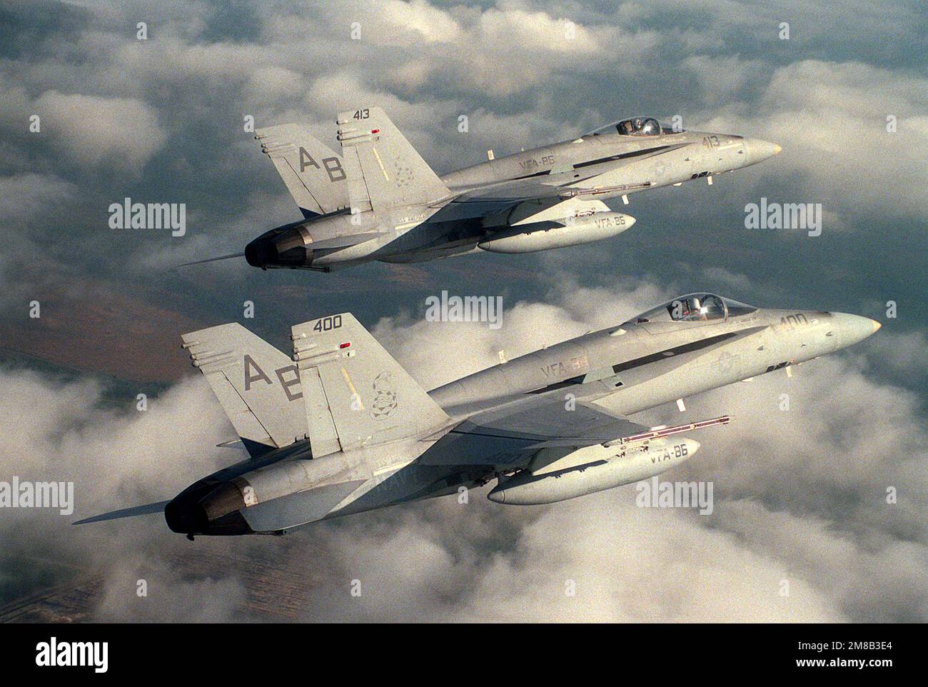 An air-to-air right side view of two Strike Fighter Squadron (VFA-86) F ...