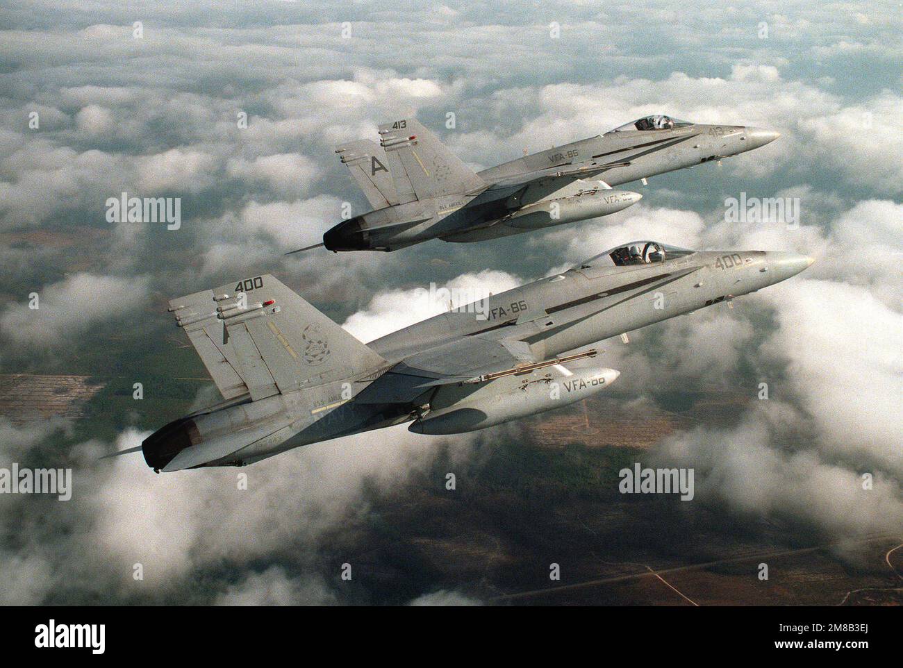 An air-to-air right side view of two Strike Fighter Squadron (VFA-86) F ...