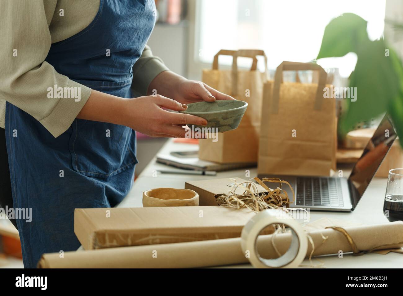 Unrecognisable woman entrepreneur, Business owner working at home ...