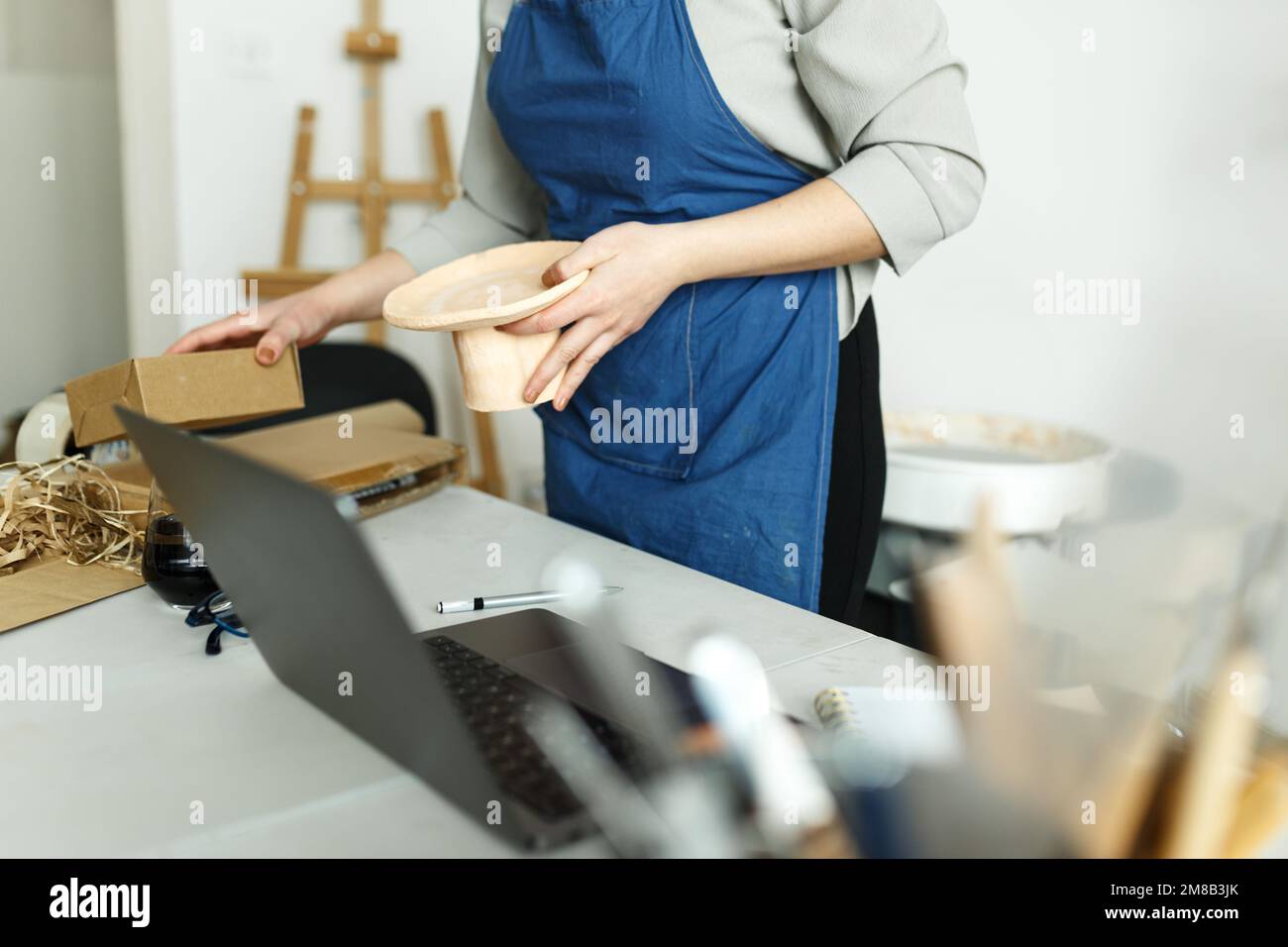 Unrecognisable woman entrepreneur, Business owner working at home ...