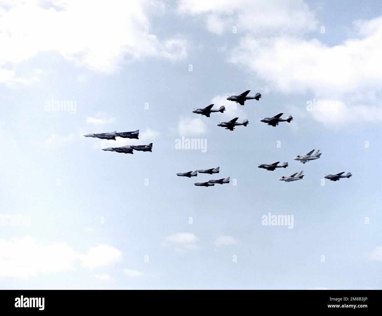 Various U.S. Navy aircraft fly in formation during a flyover ...