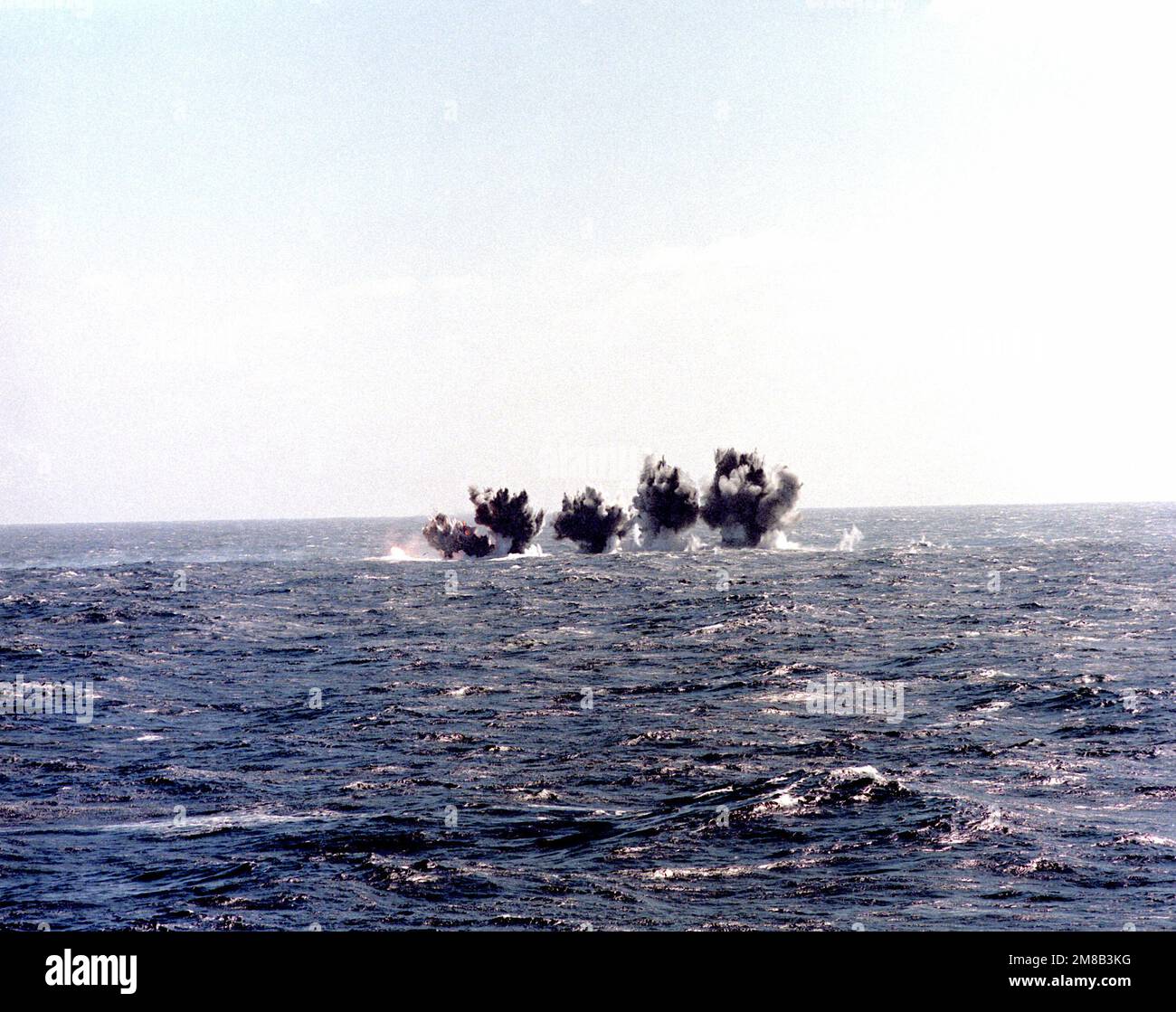 Ordnance hits the water after being airdropped during a flyover, part ...