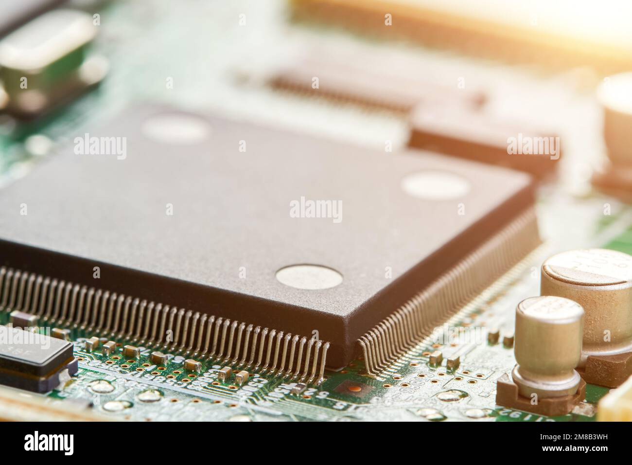 Close-up of computer chip on a part of electronic printed circuit board ...