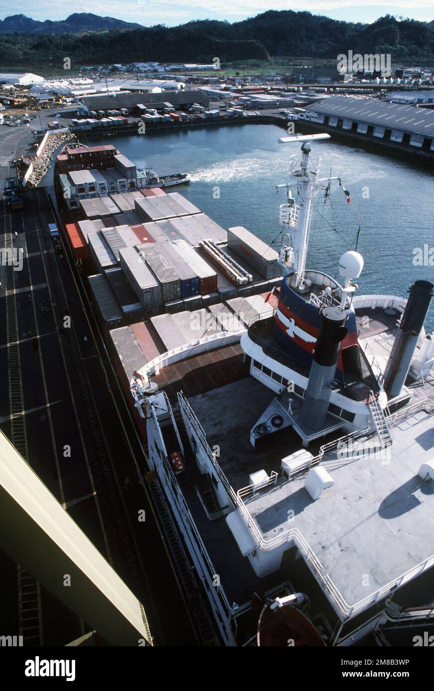 A US Navy large harbor tug helps move the Military Sealift Command ...