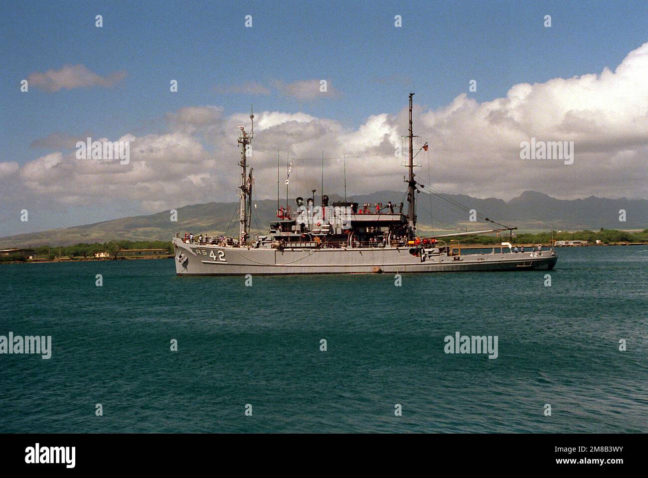 A port beam view of the salvage ship USS RECLAIMER (ARS-42). Base ...