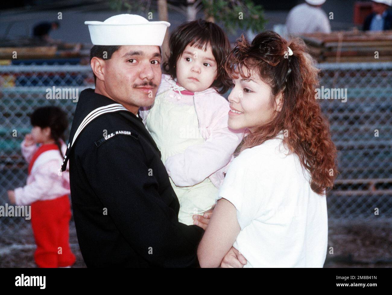A sailor stationed aboard the aircraft carrier USS RANGER (CV-61) is ...