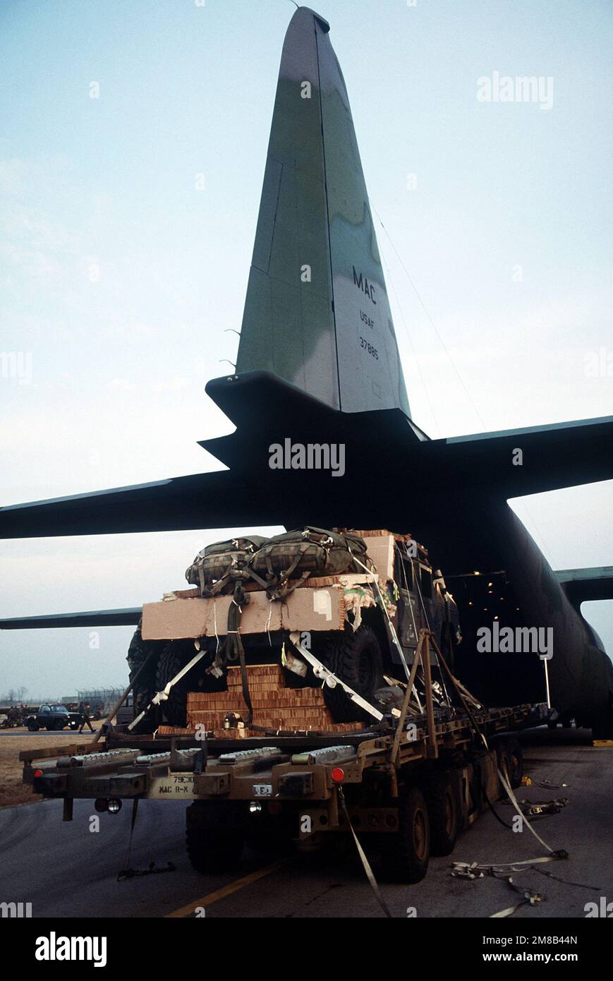 M998 high mobility multipurpose wheeled vehicles are loaded from a K ...