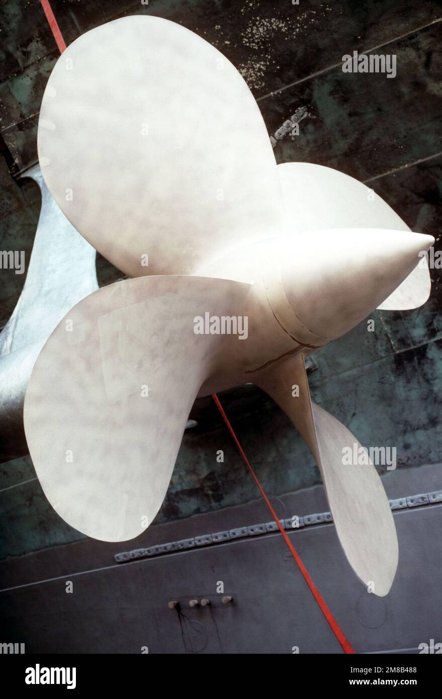 A close-up view of the outboard port side propeller of the battleship ...