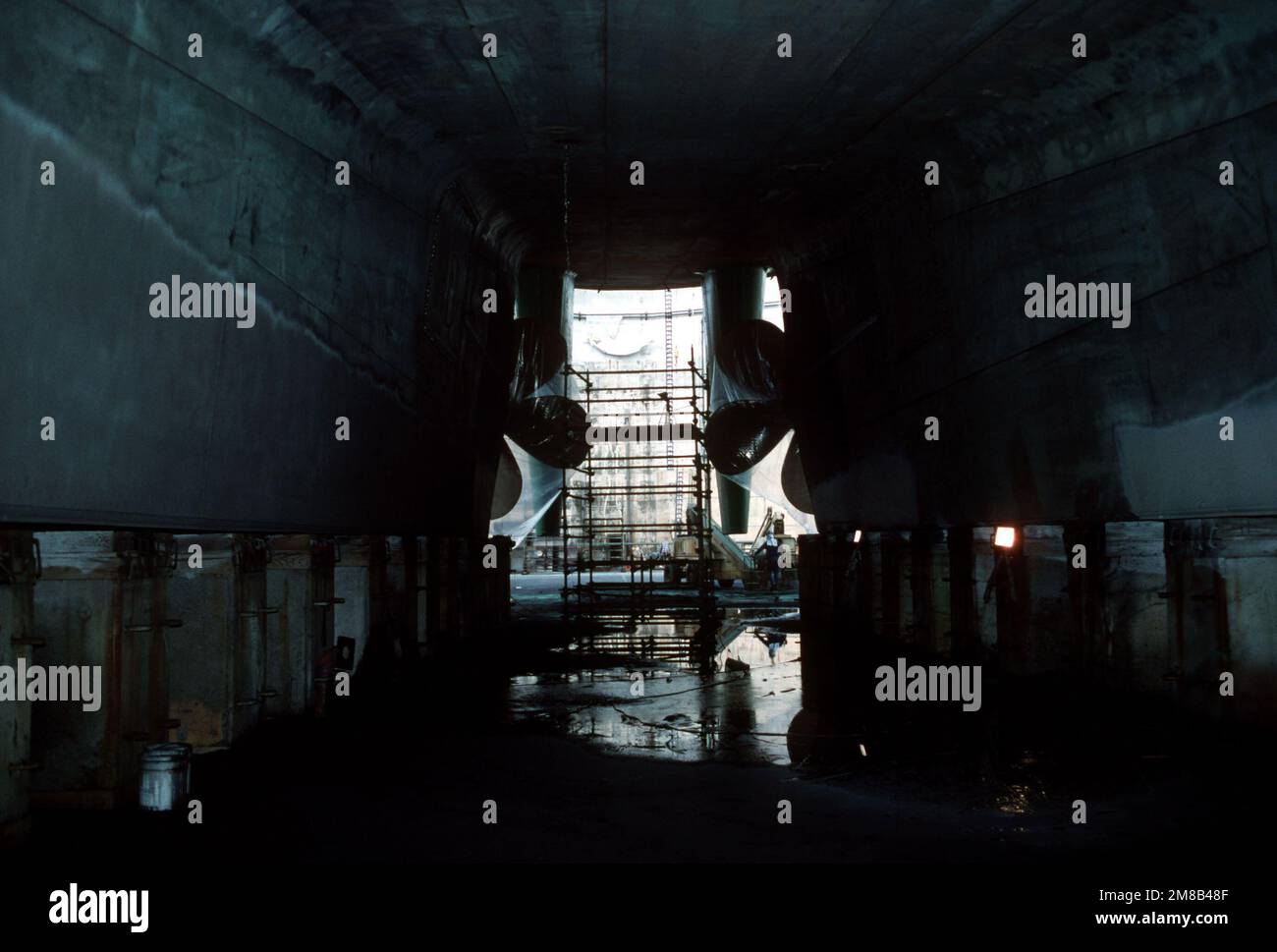 A view looking aft from beneath the battleship USS MISSOURI (BB-63 ...