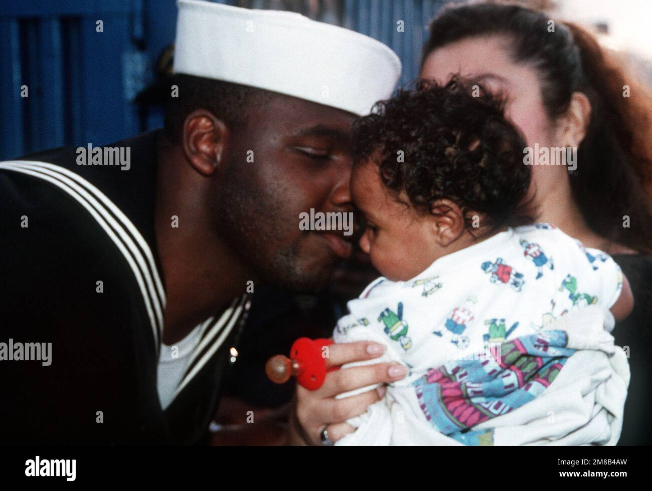 A sailor stationed aboard the aircraft carrier USS RANGER (CV-61) bends ...