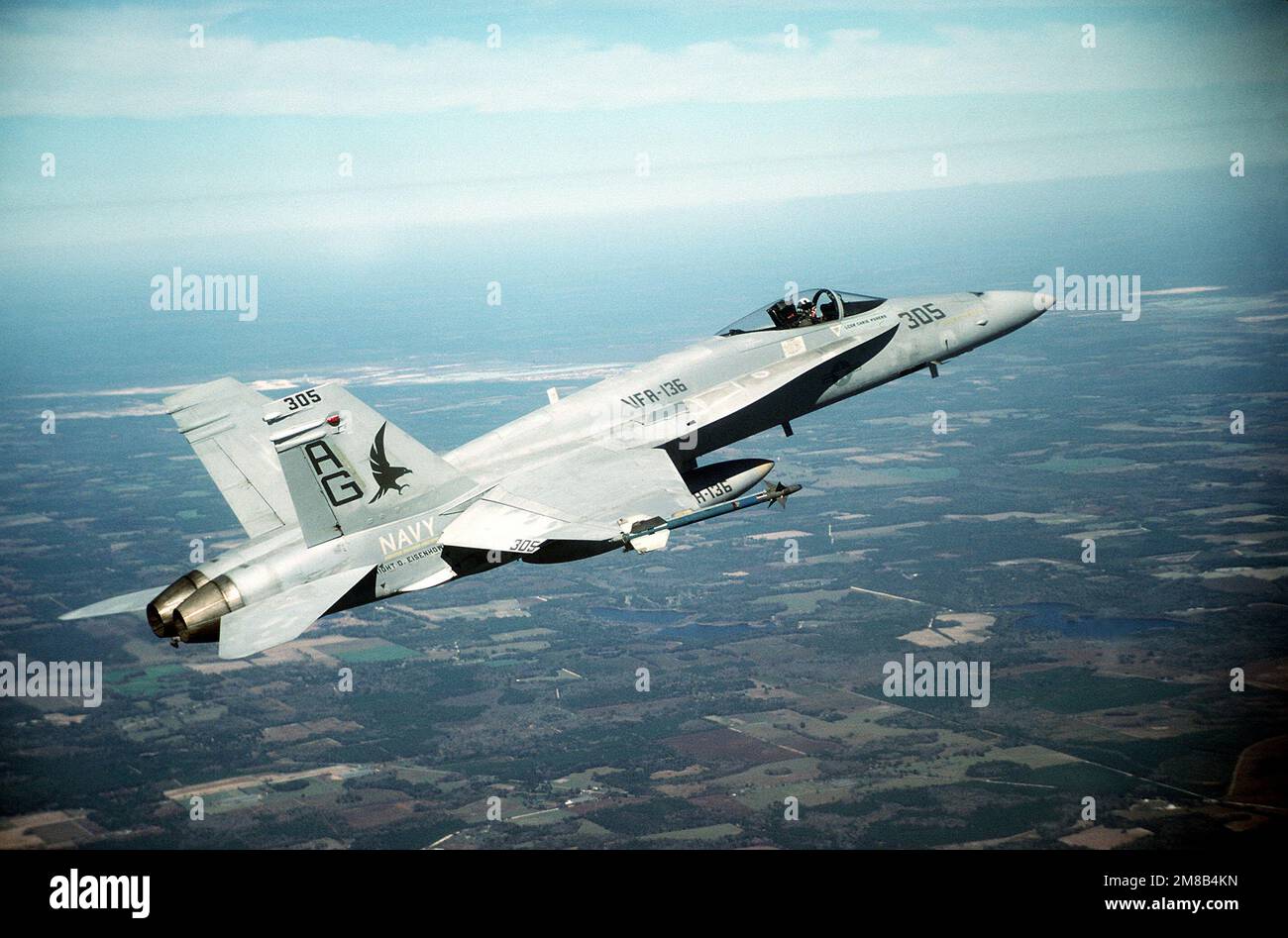 An air-to-air right side view of a Strike Fighter Squadron 136 (VFA-136 ...