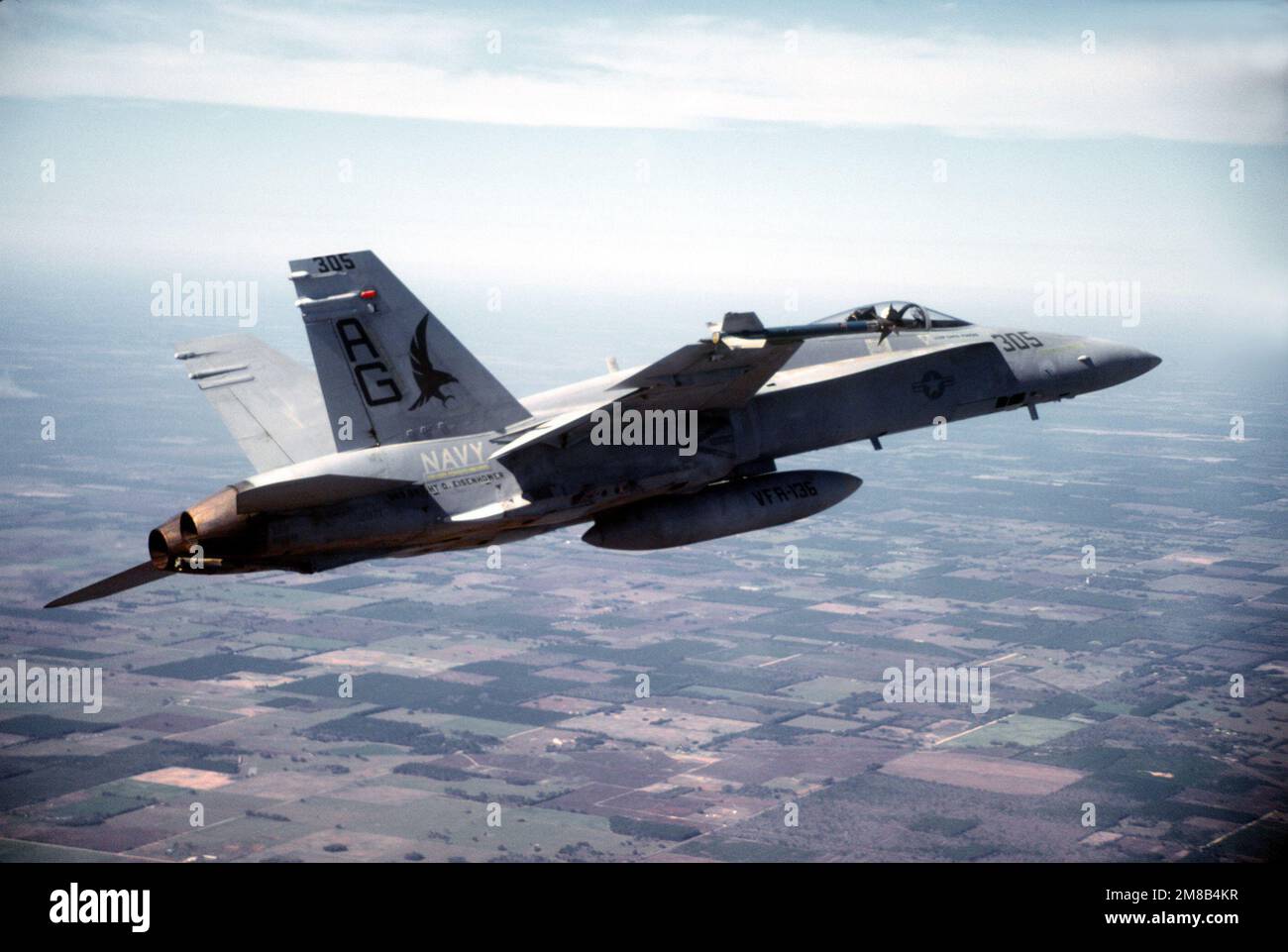 An air-to-air right side view of a Strike Fighter Squadron 136 (VFA-136 ...