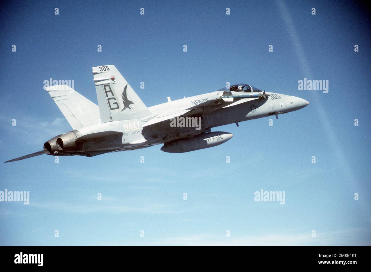 An air-to-air right side view of a Strike Fighter Squadron 136 (VFA-136 ...