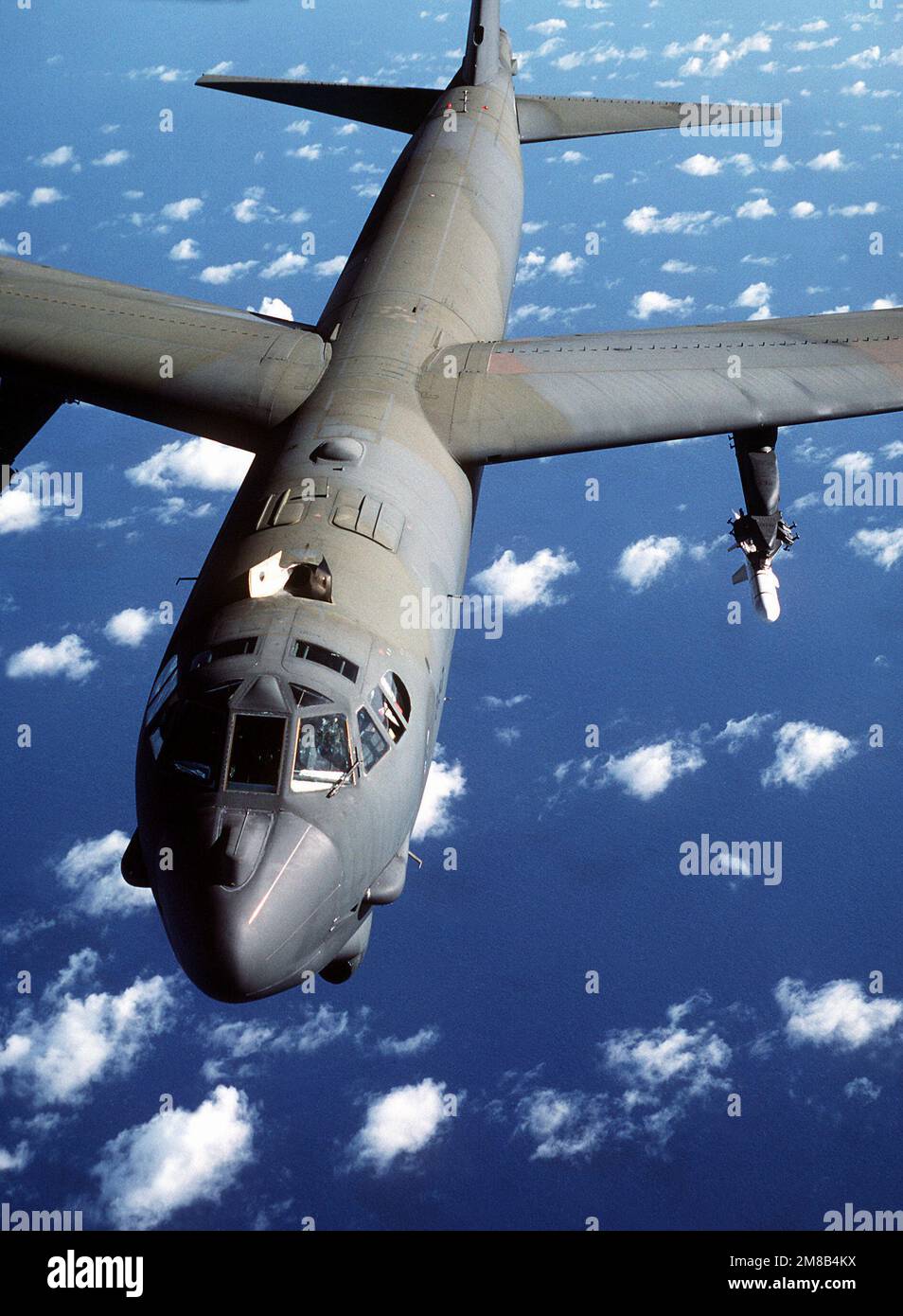 An air-to-air front view of a B-52G Stratofortress aircraft armed with ...
