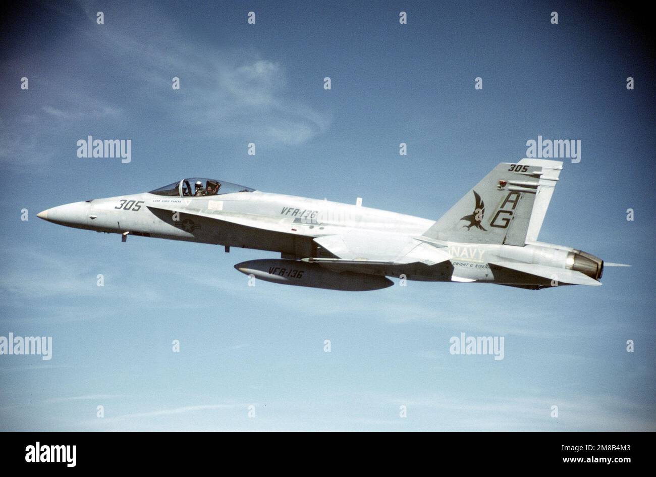 An air-to-air left side view of a Strike Fighter Squadron 136 (VFA-136 ...