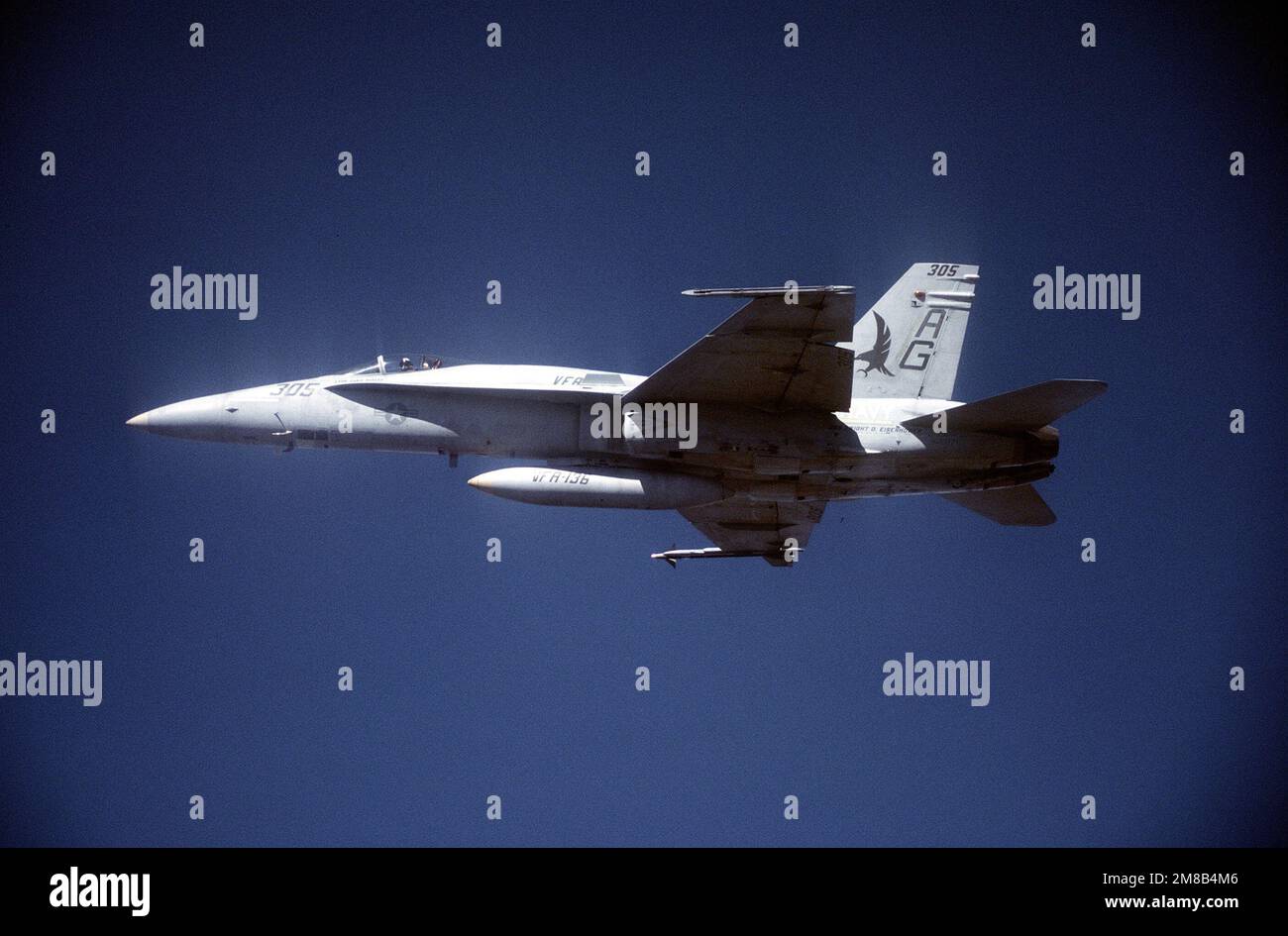 An air-to-air left underside view of a Strike Fighter Squadron 136 (VFA ...