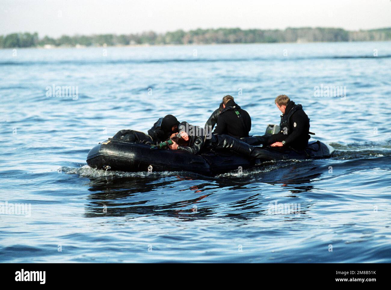 Army Special Forces personnel are prepared for combat as their Zodiac ...