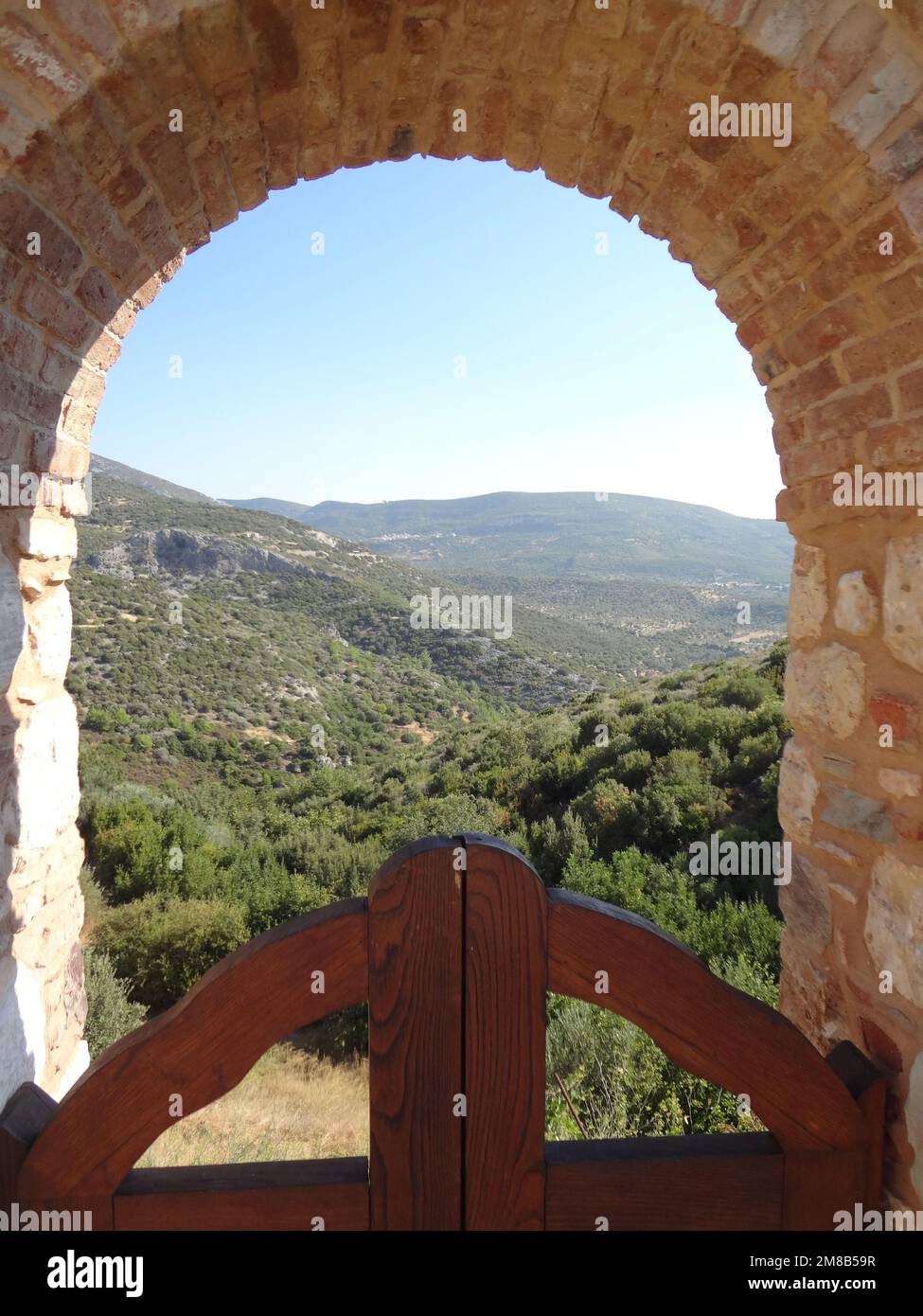 View through an arch near the monastery Megali Panagia on the island of ...