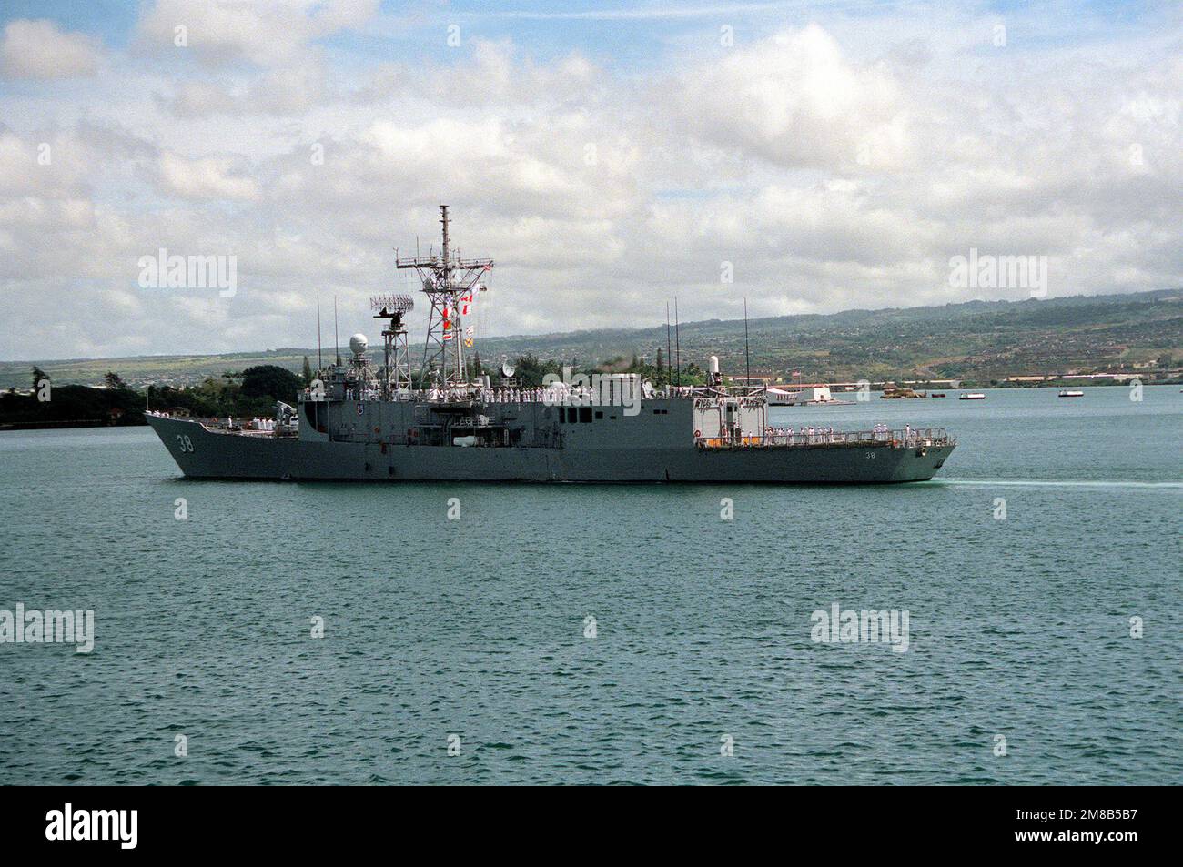 Sailors man the rails aboard the guided missile frigate USS CURTS (FFG ...