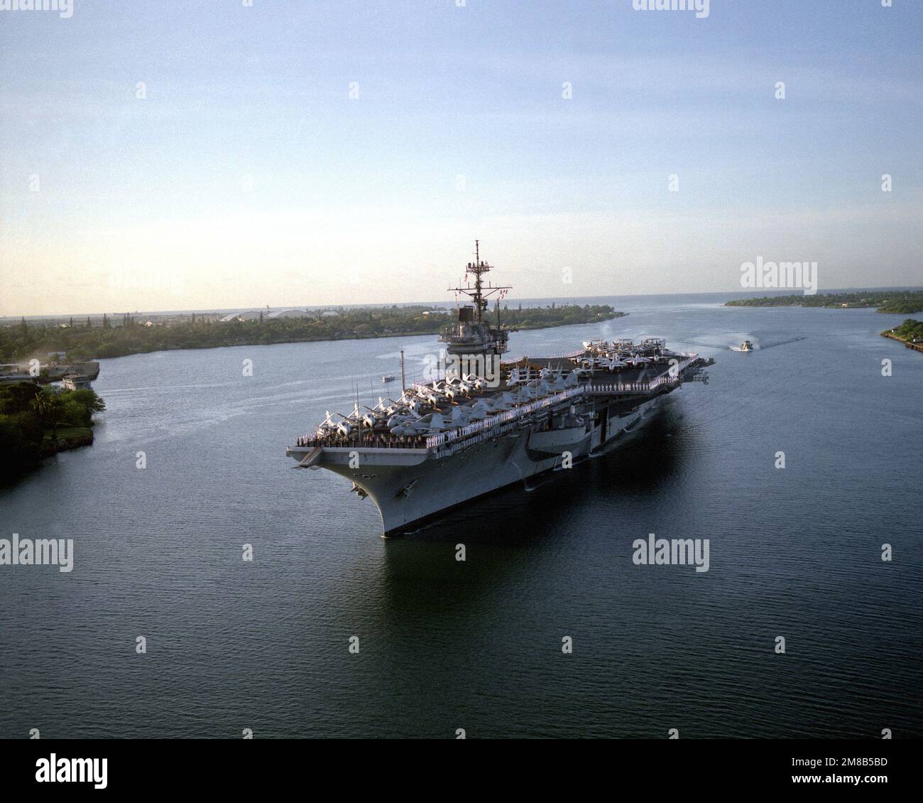 Marines and sailors man the rail of the aircraft carrier USS RANGER (CV ...