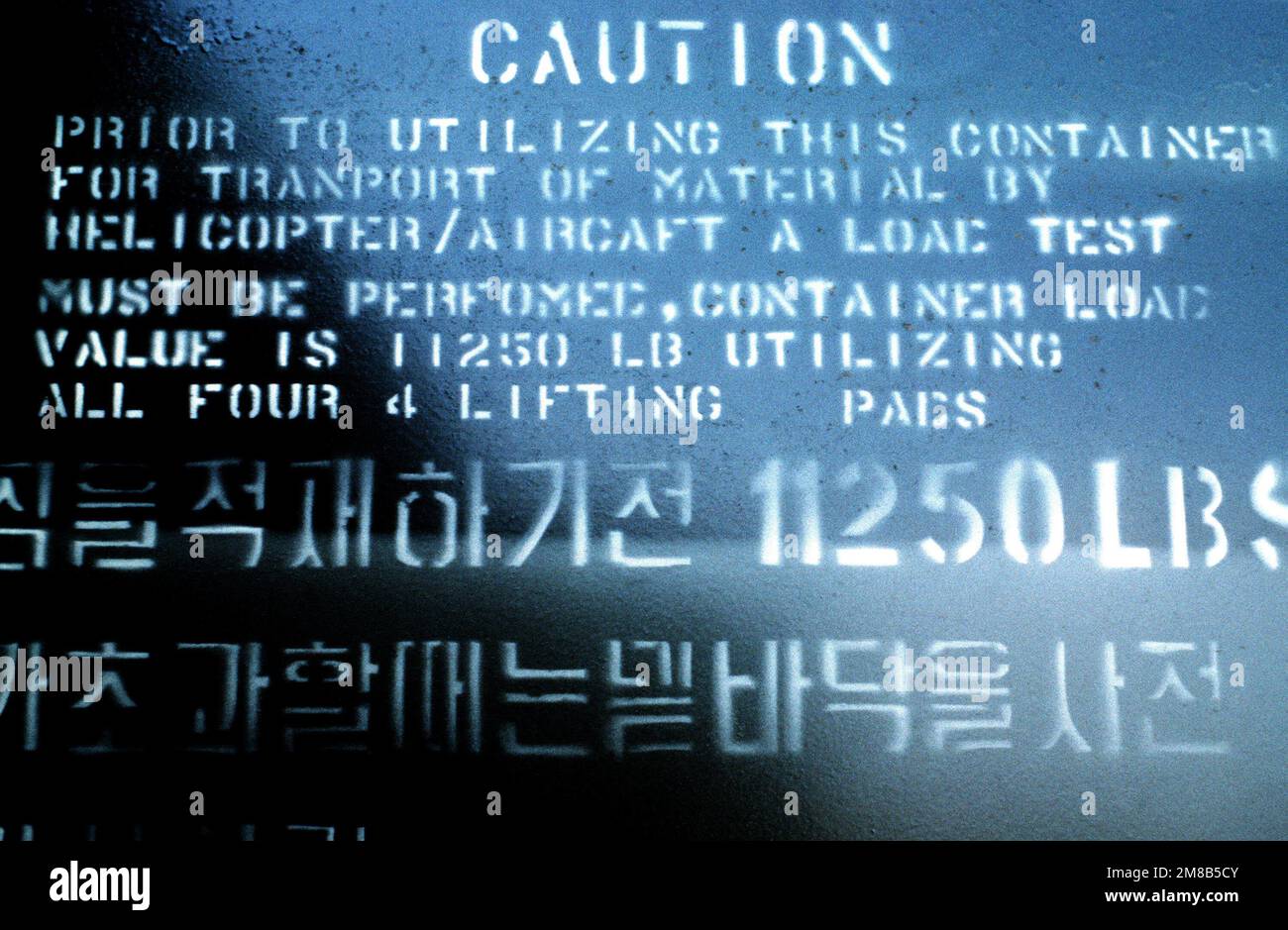 A label in English and Korean gives the load value of a container of a ...