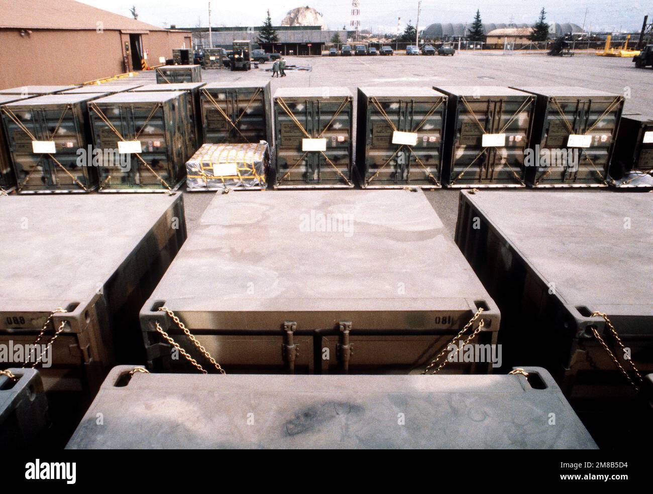 A Harvest Eagle tent city kit waits for transport to its site during ...