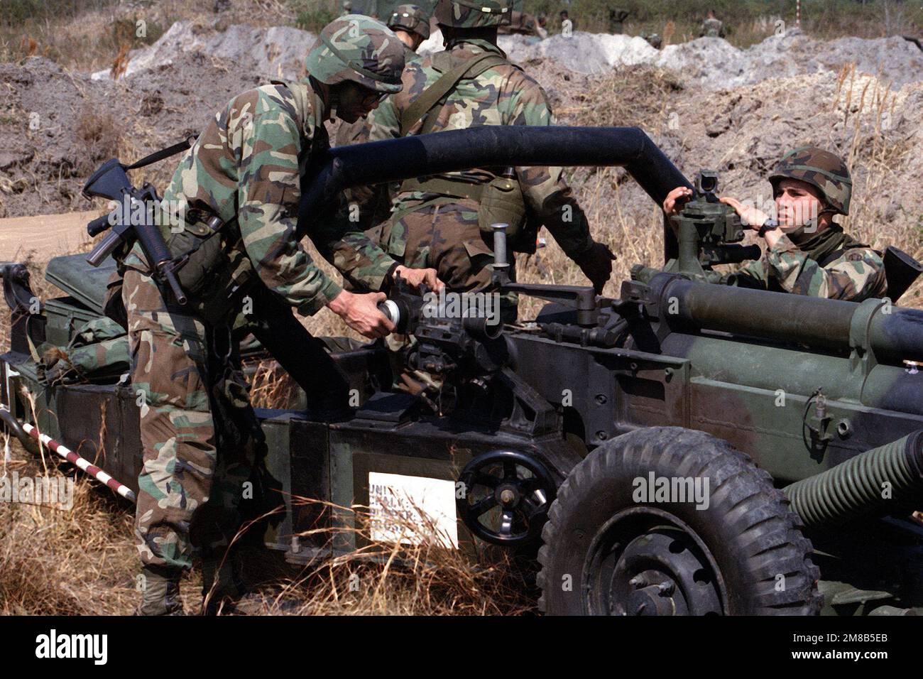 Two soldiers of the 82nd Airborne Division mount and adjust the fire ...