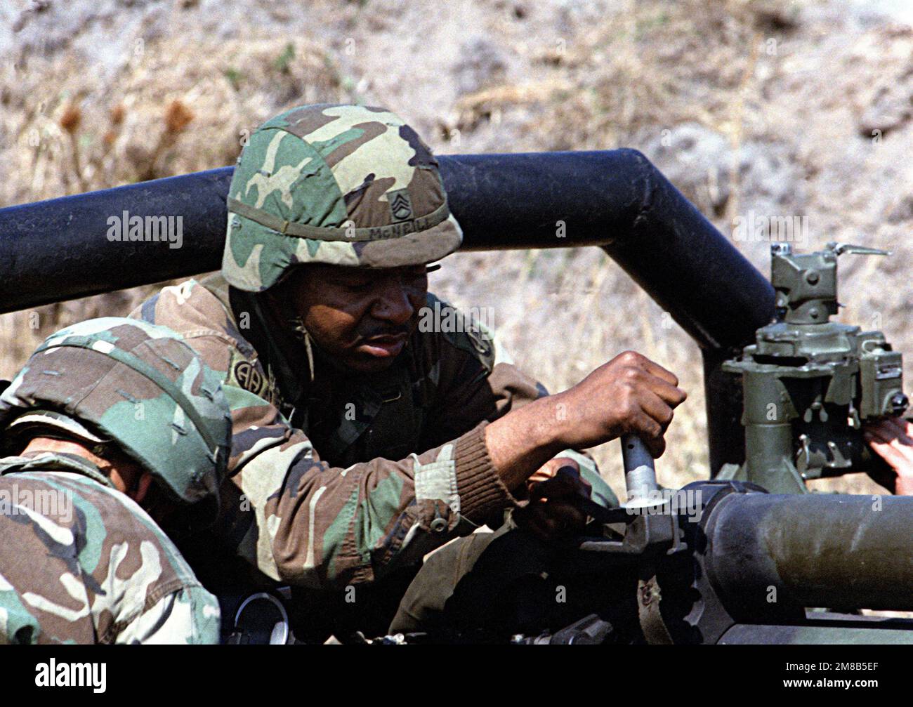 A staff sergeant with the 82nd Airborne Division opens the breech of an ...