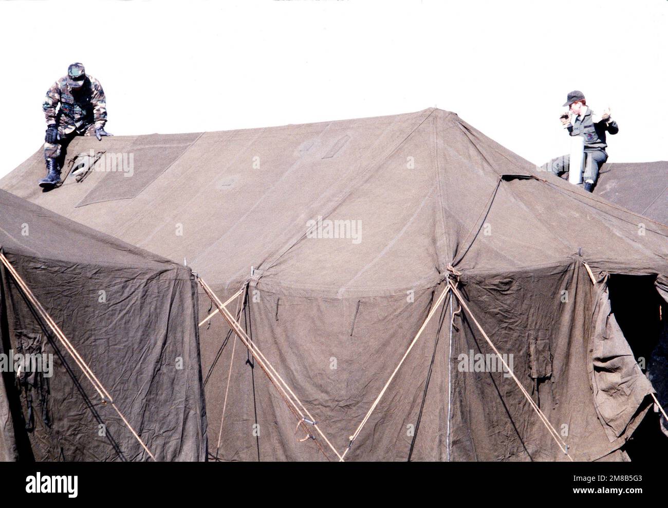 Members of a Prime Beef construction team install exhaust pipes in ...