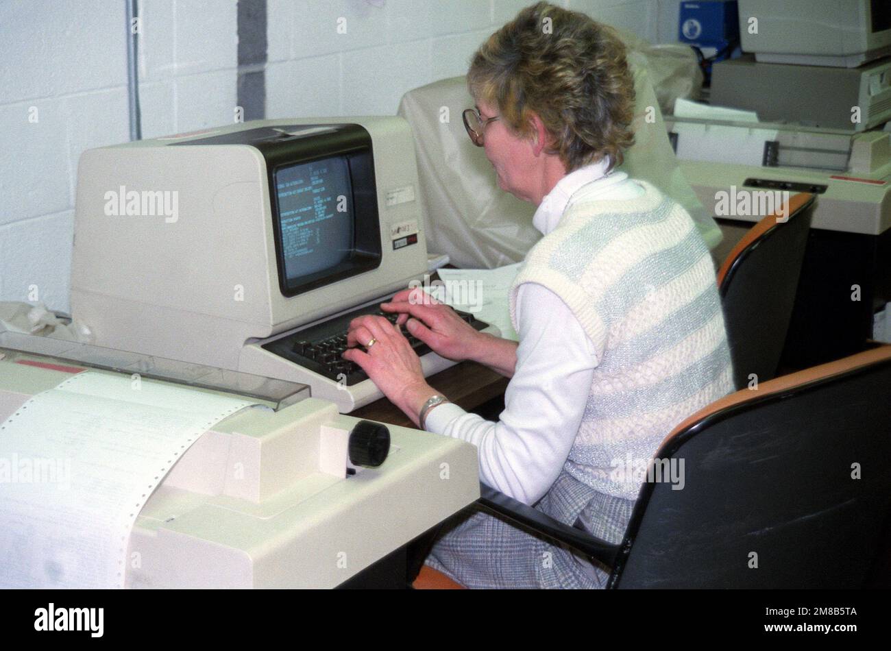 Mrs. Sandi Edwards uses a computer at the Joint Visual Information ...
