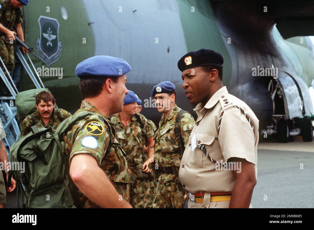 LTC Kevin Pippard, left, speaks to LTC Frank Mwangangi of the Kenyan ...