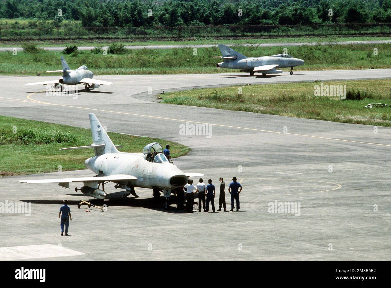 Honduran Super Mystere B.2 aircraft taxi on the flight line as ground ...