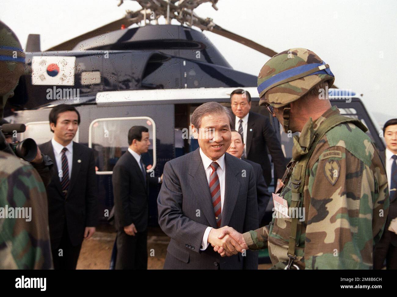 South Korean President Roh Tae Woo is greeted by MGEN Charles P. Ostott ...