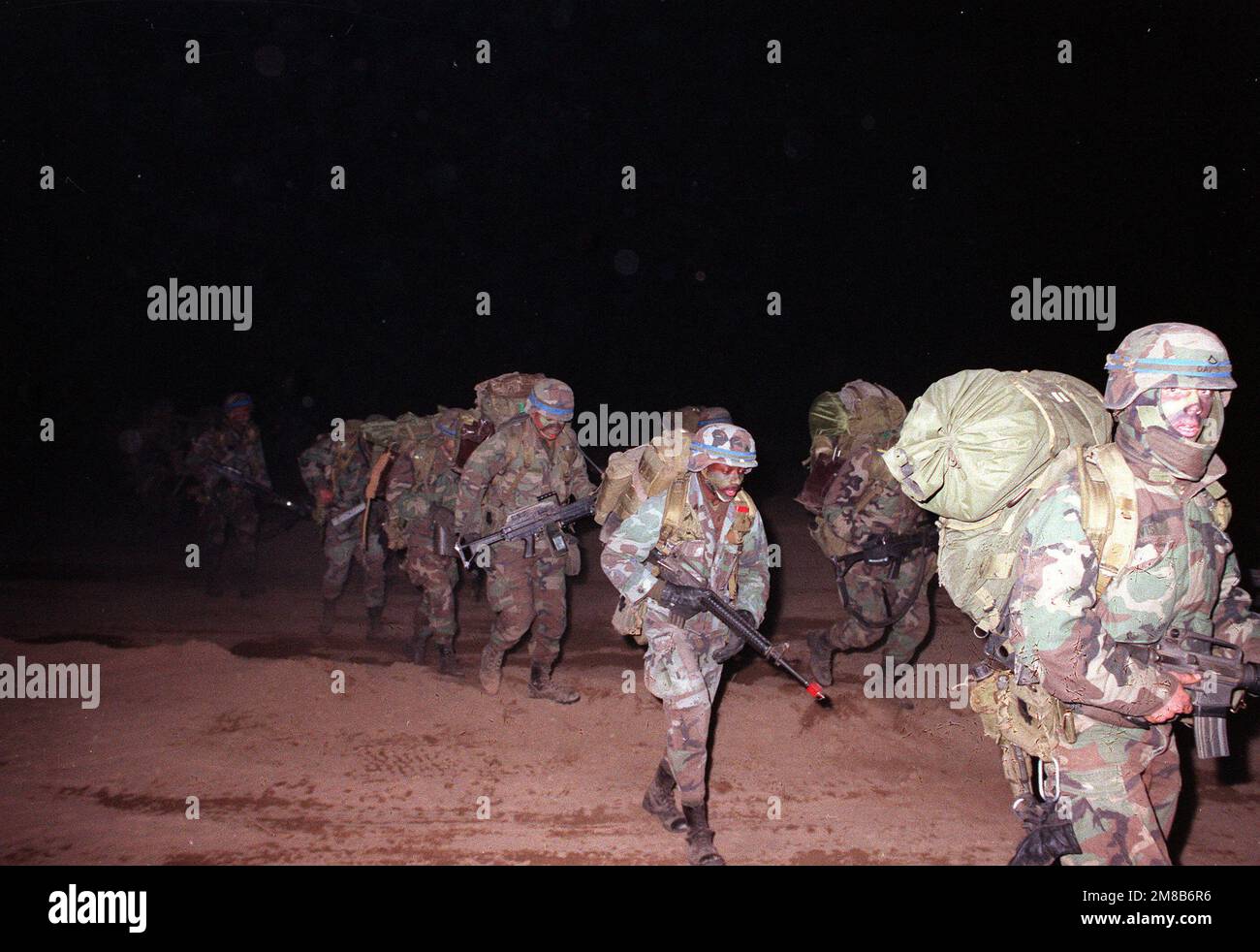 Members of Co. A, 3rd Bn., 22nd Inf., 25th Inf. Div. (Light) leave their positions to board an ...