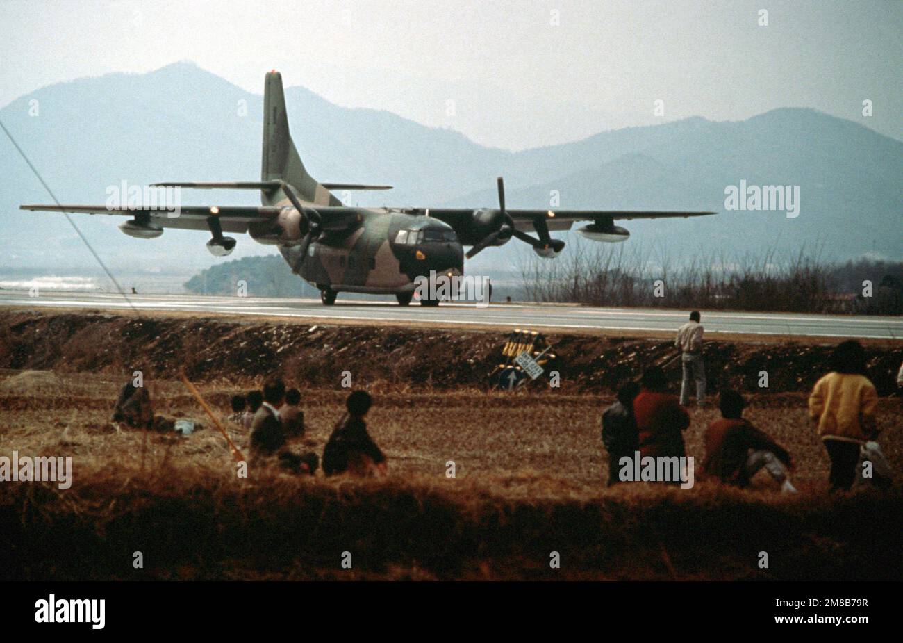 A South Korean air force C-123 Provider aircraft waits to pick up ...
