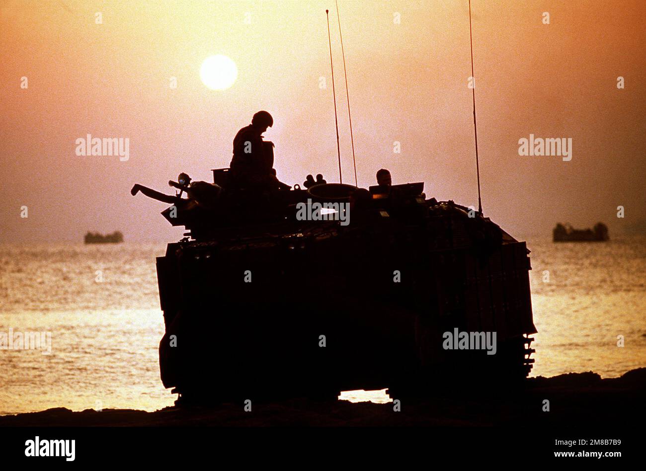 U.S. Marines in an AAVP-7A1 amphibious assault vehicle pause on the ...