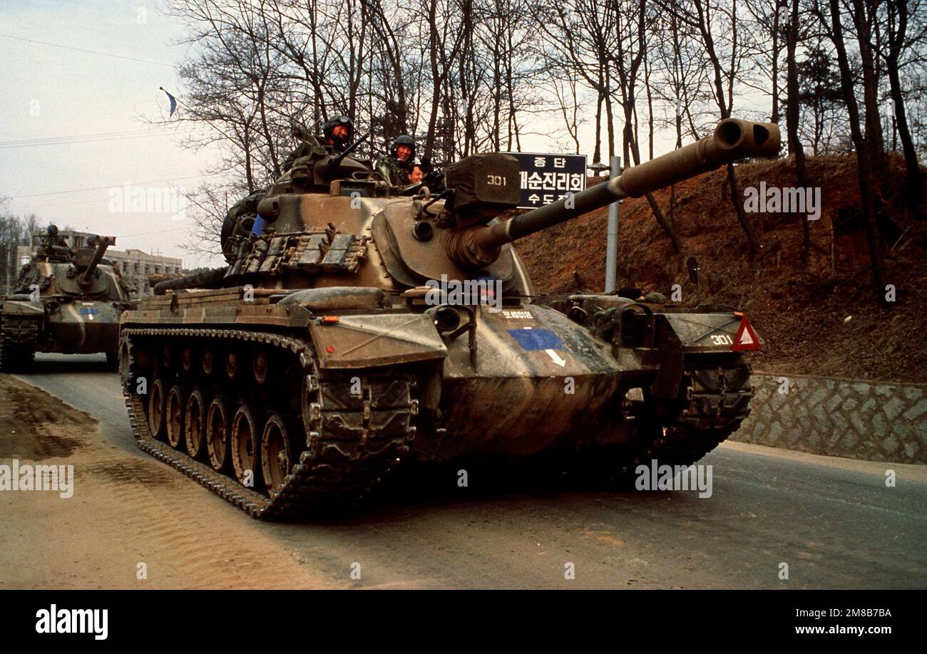 Two South Korean M-48 tanks advance down a road during the joint South ...