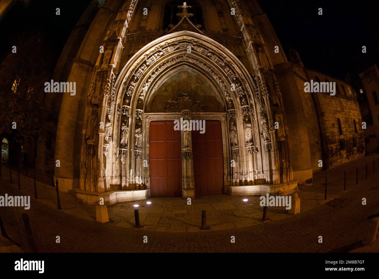A front view of Aix-en-Province church gate at night with beautiful ...