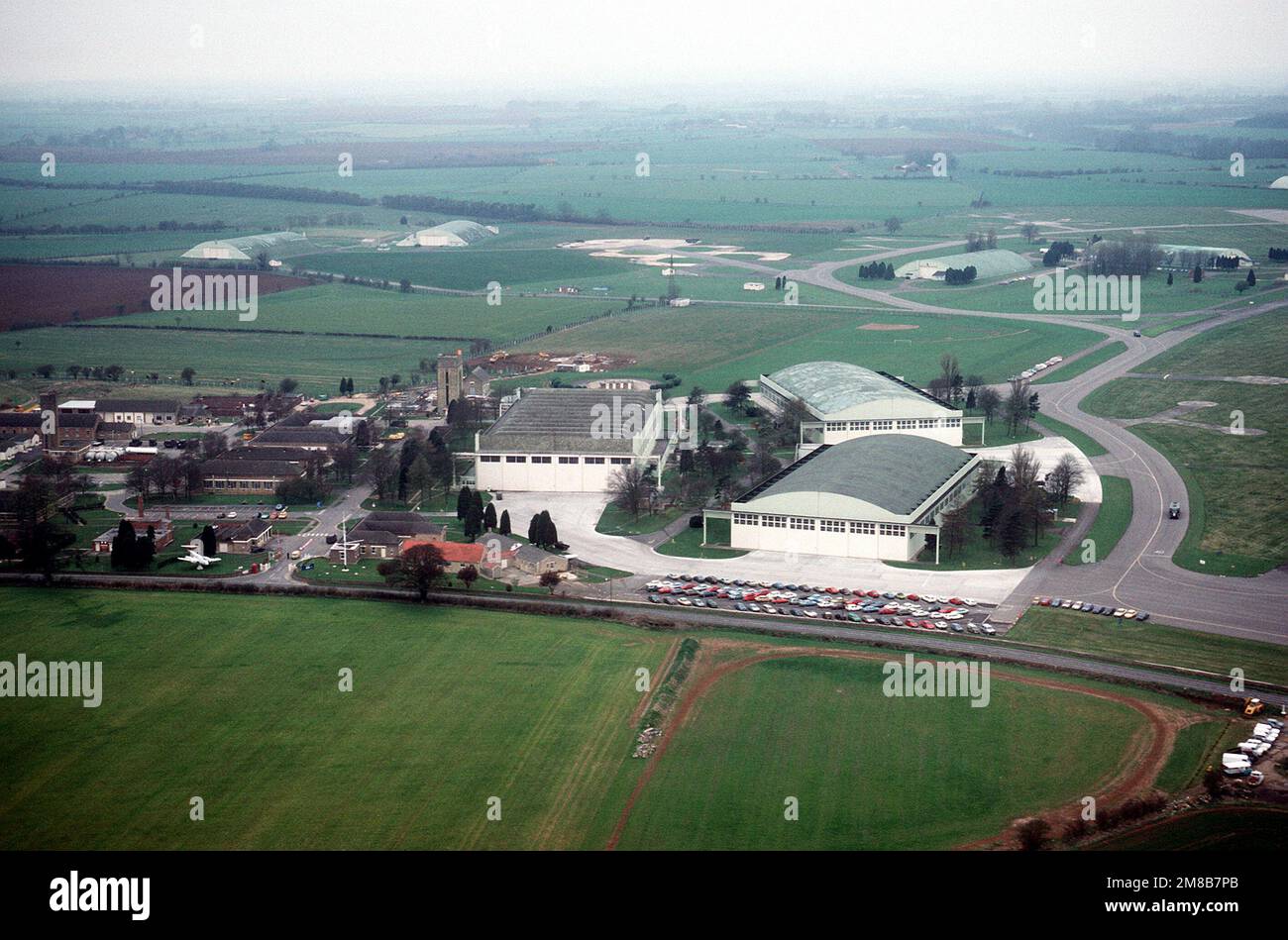An aerial view of the front gate, left, and support buildings on the ...