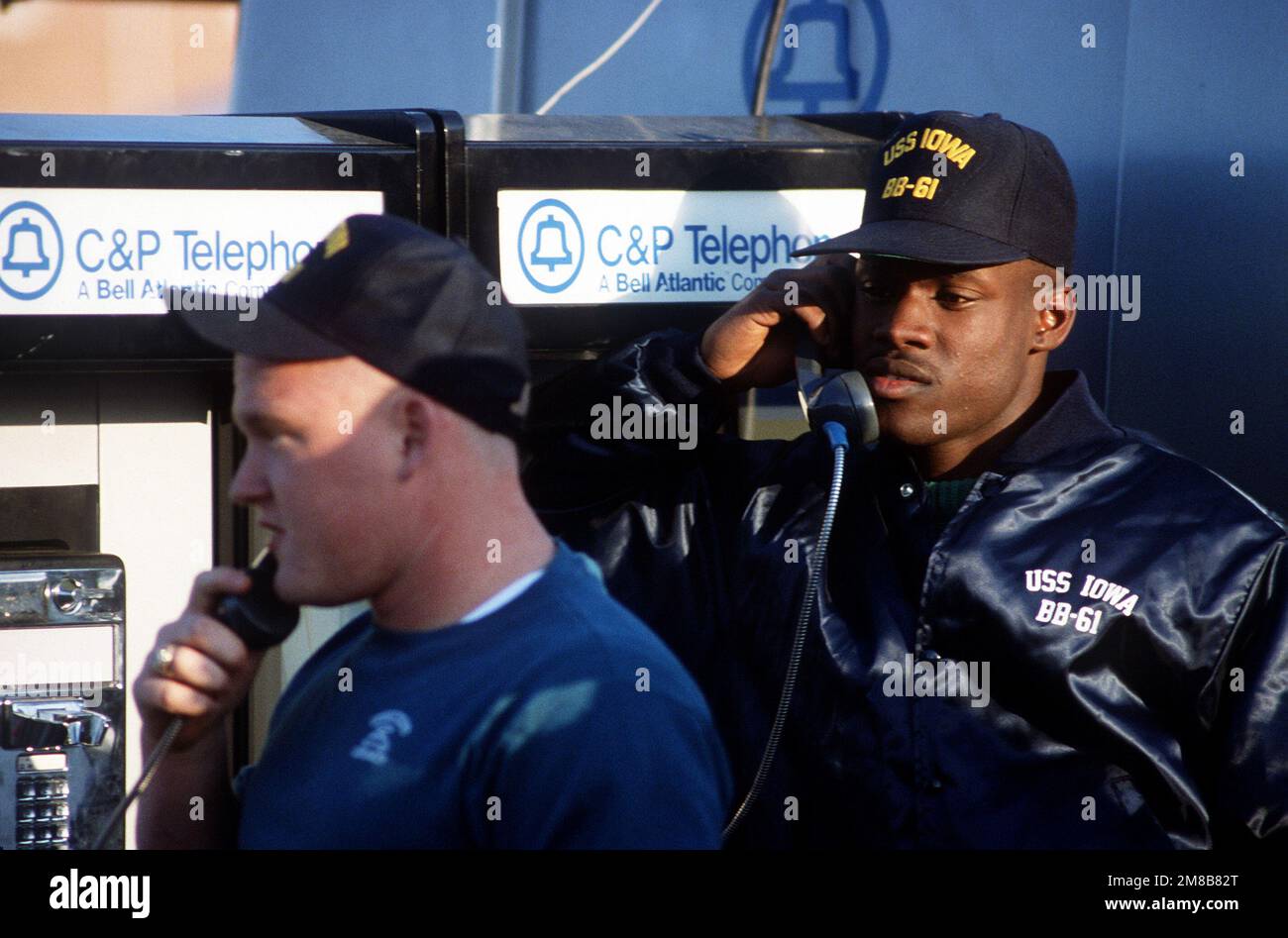Sailors from the battleship USS Iowa (BB-61) contact family members ...