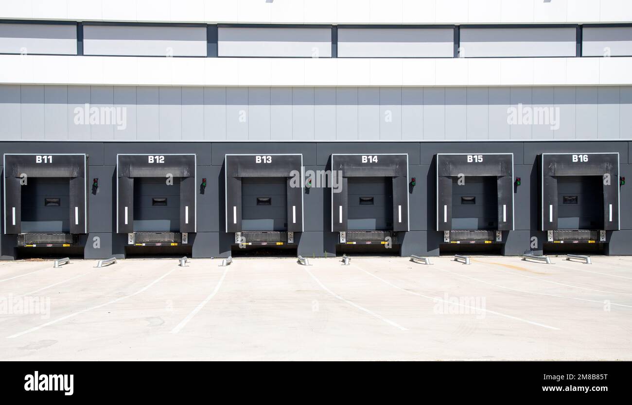 A row of loading docks with shutter doors at a warehouse Stock Photo ...