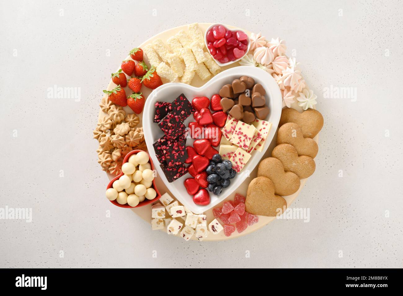 Charcuterie Valentines Day board with chocolate sweets, red hearts ...