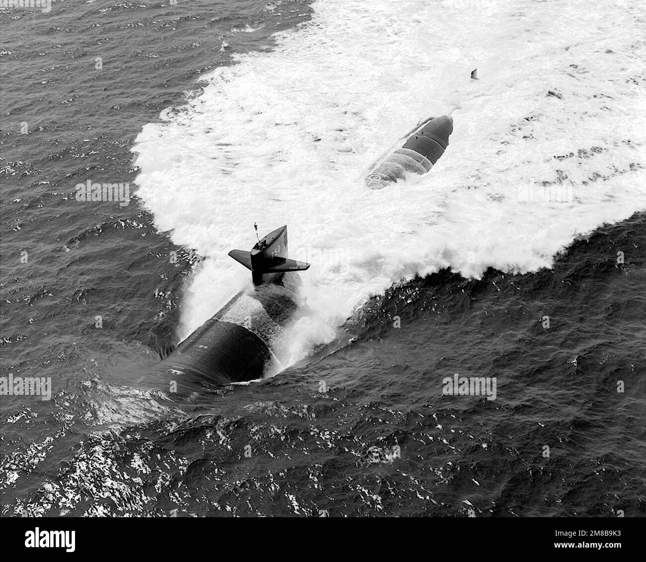 A port bow view of the nuclear-powered attack submarine USS NEWPORT ...