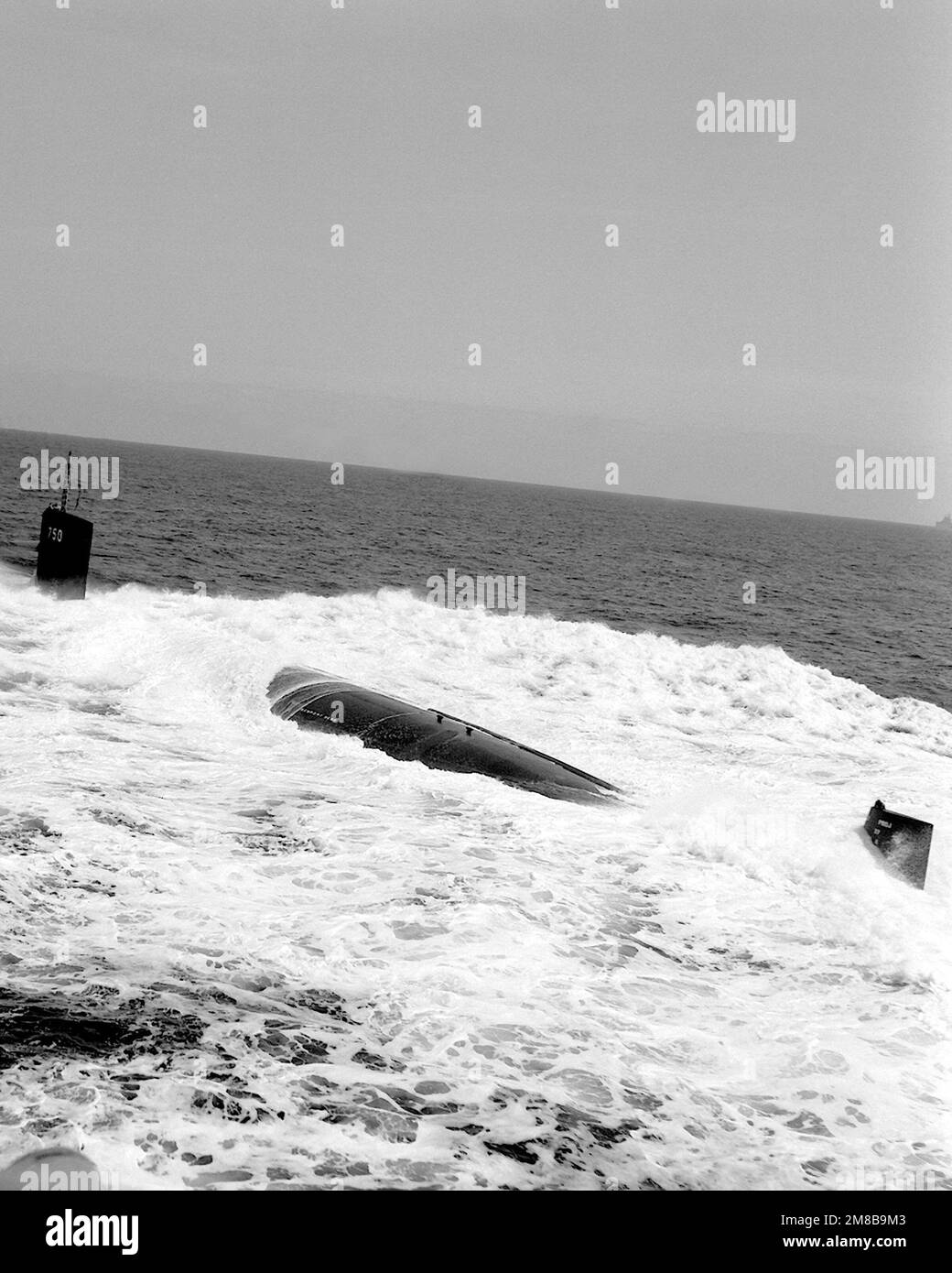 A port quarter view of the nuclear-powered attack submarine USS NEWPORT ...