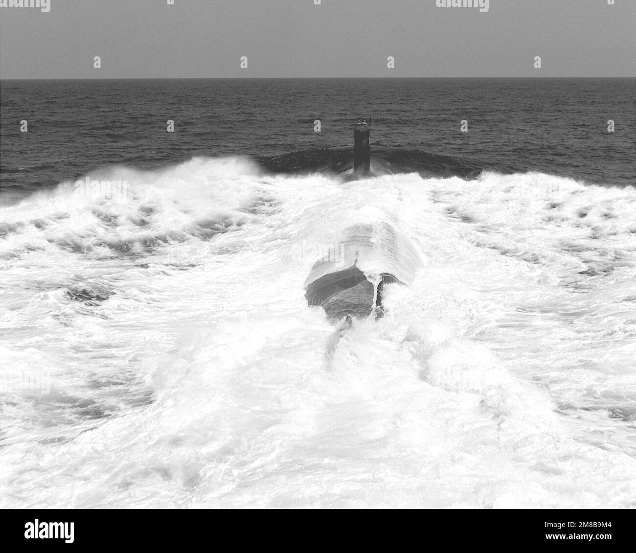 A stern view of the nuclear-powered attack submarine USS NEWPORT NEWS ...
