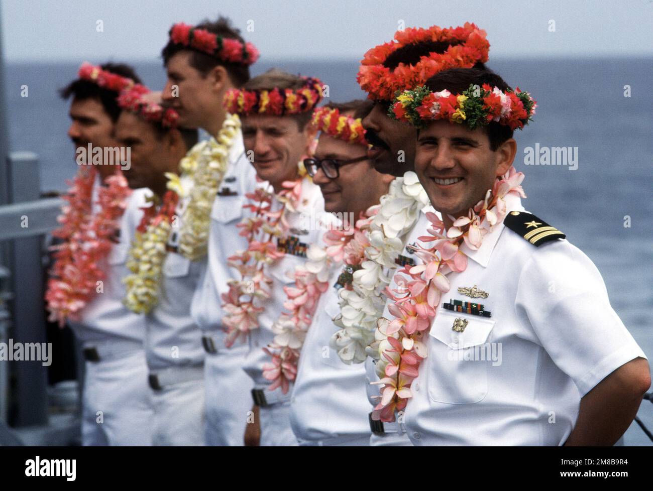 The officers of the salvage and rescue ship USS BRUNSWICK (ATS-3) wear ...