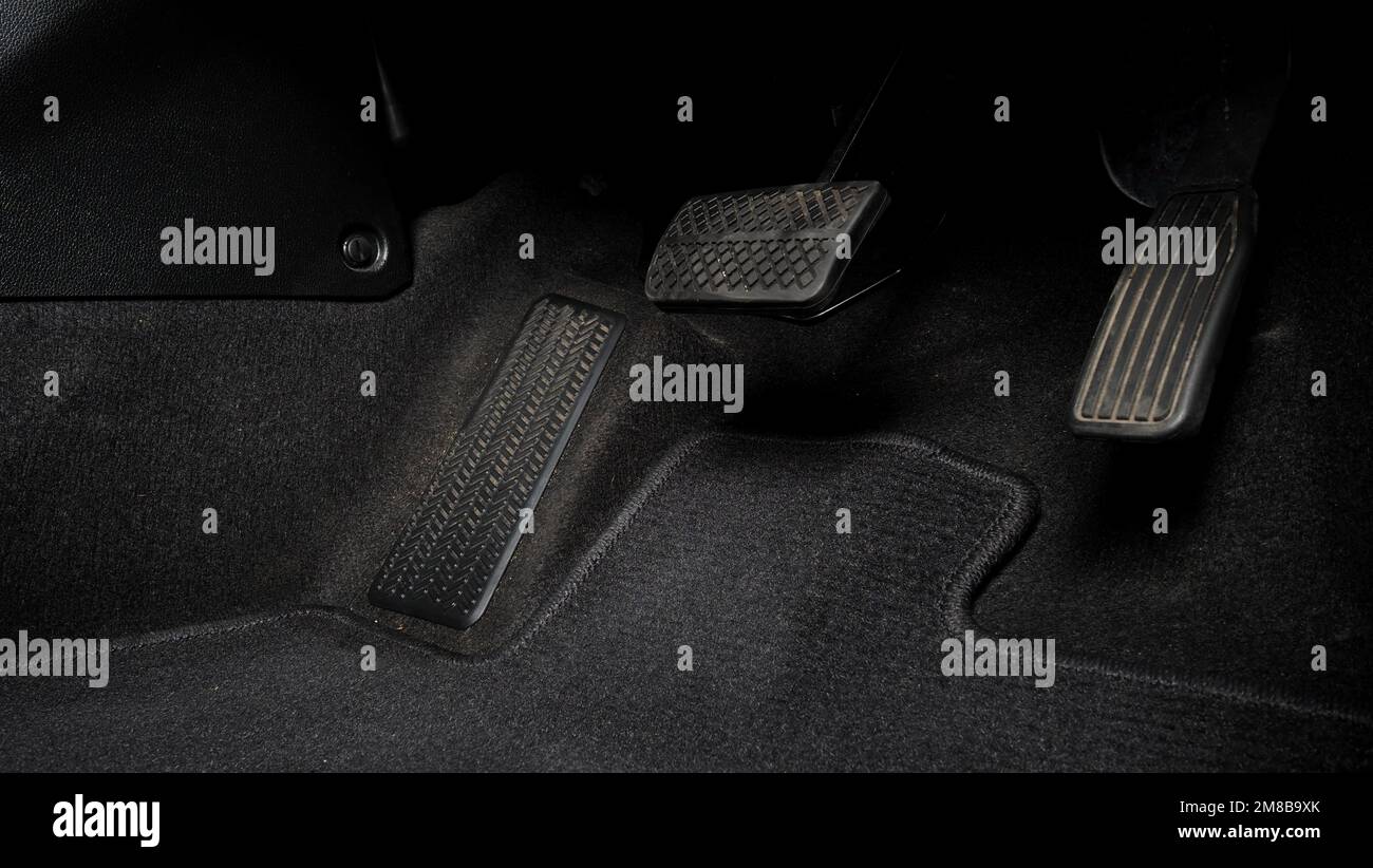 Car accelerate and brake foot pedal. Close up foot press or push foot ...