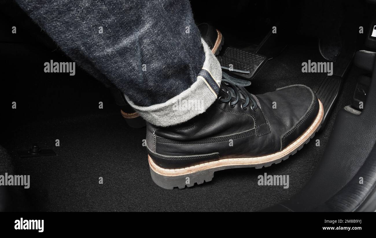 Car accelerate and brake foot pedal. Close up foot press or push foot ...