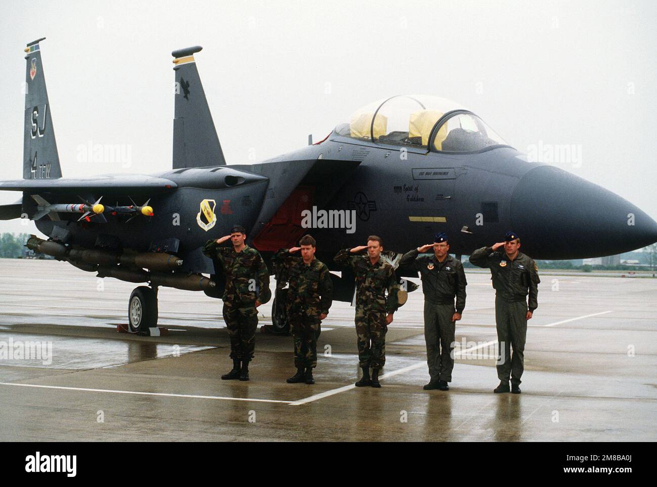 Five members of the 336th Tactical Fighter Squadron, 4th Tactical Fighter Wing (4th TFW), salute ...