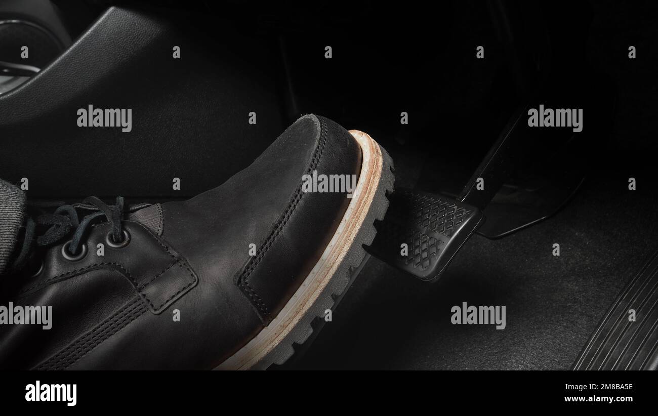 Car accelerate and brake foot pedal. Close up foot press or push foot ...